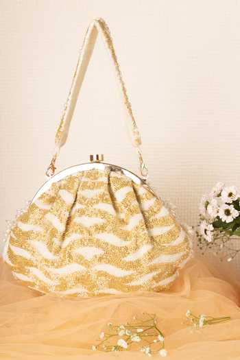 Buy Gold Embroidered Pearl Potli by Ara Studio Online at Aza Fashions.