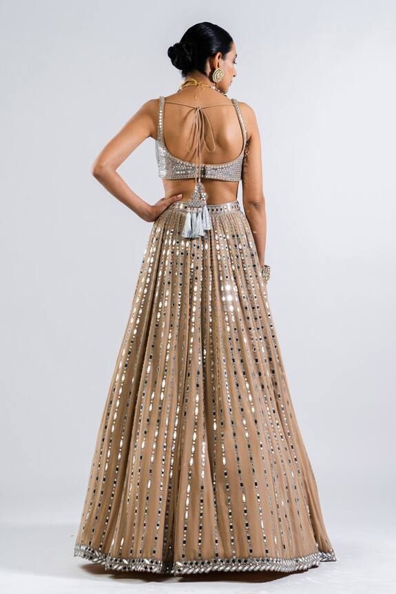 Buy Vvani by Vani Vats Beige Linear Pattern Mirror Embellished Lehenga ...