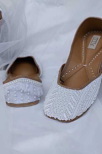 Buy White Embroidered Pearl Juttis by Jutti Express Online at Aza Fashions.