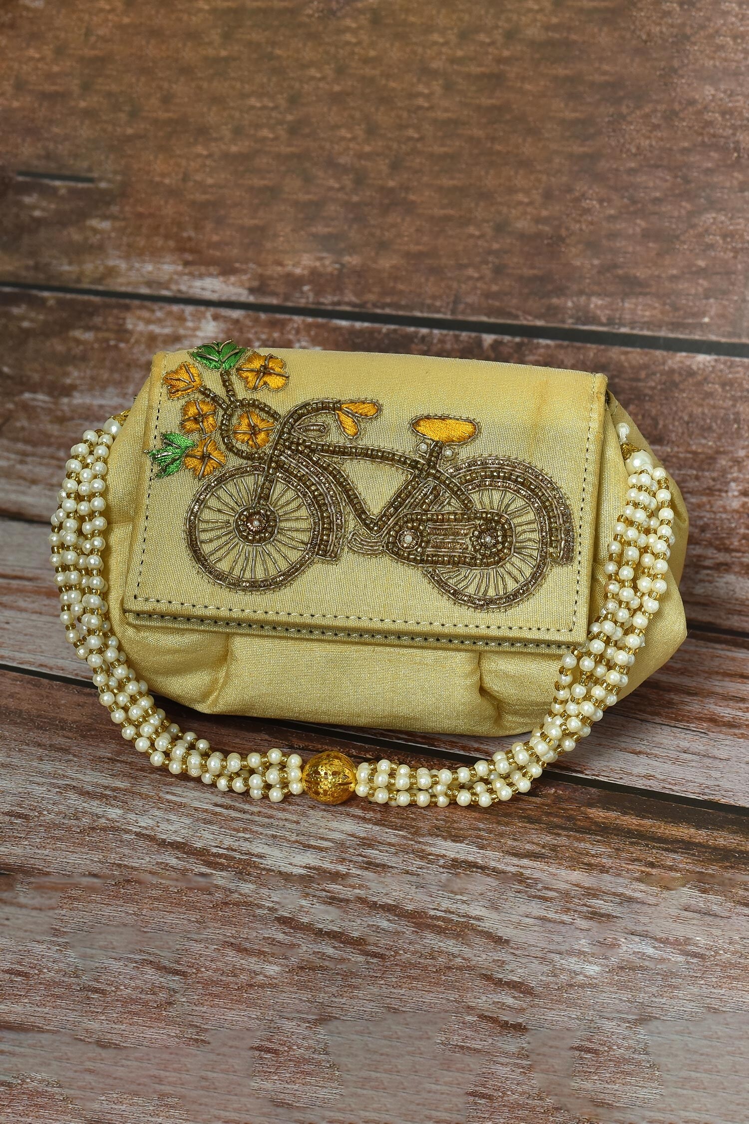 Buy Beige Embroidered Cycle Pouch Bag by Nayaab by Aleezeh Online at Aza Fashions.
