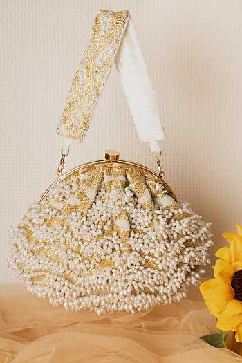 Buy Gold Embroidered Pearl Potli by Ara Studio Online at Aza Fashions.