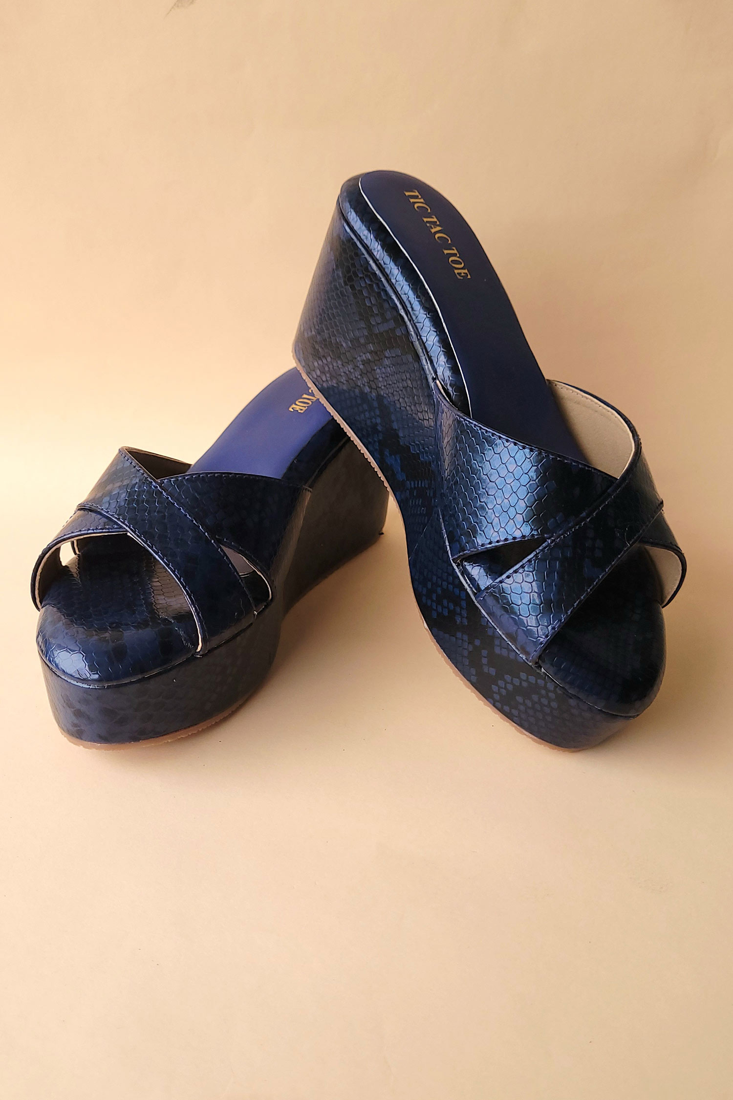 Buy Blue Textured Cross Strap Wedges by Tic Tac Toe Footwear Online at ...