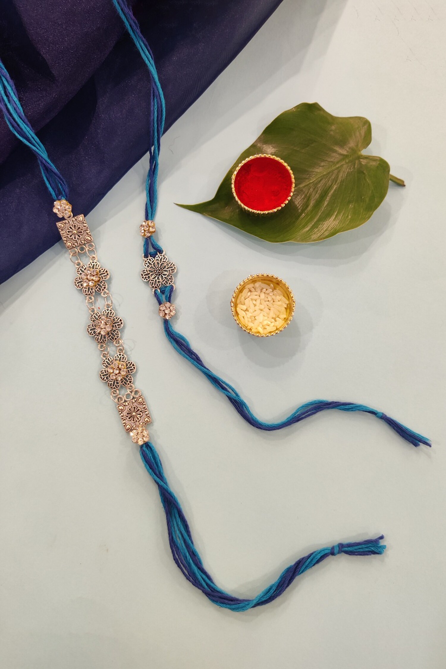 Buy Around Always Blue Silver Floral Rakhi - Set Of 2 Online | Aza Fashions