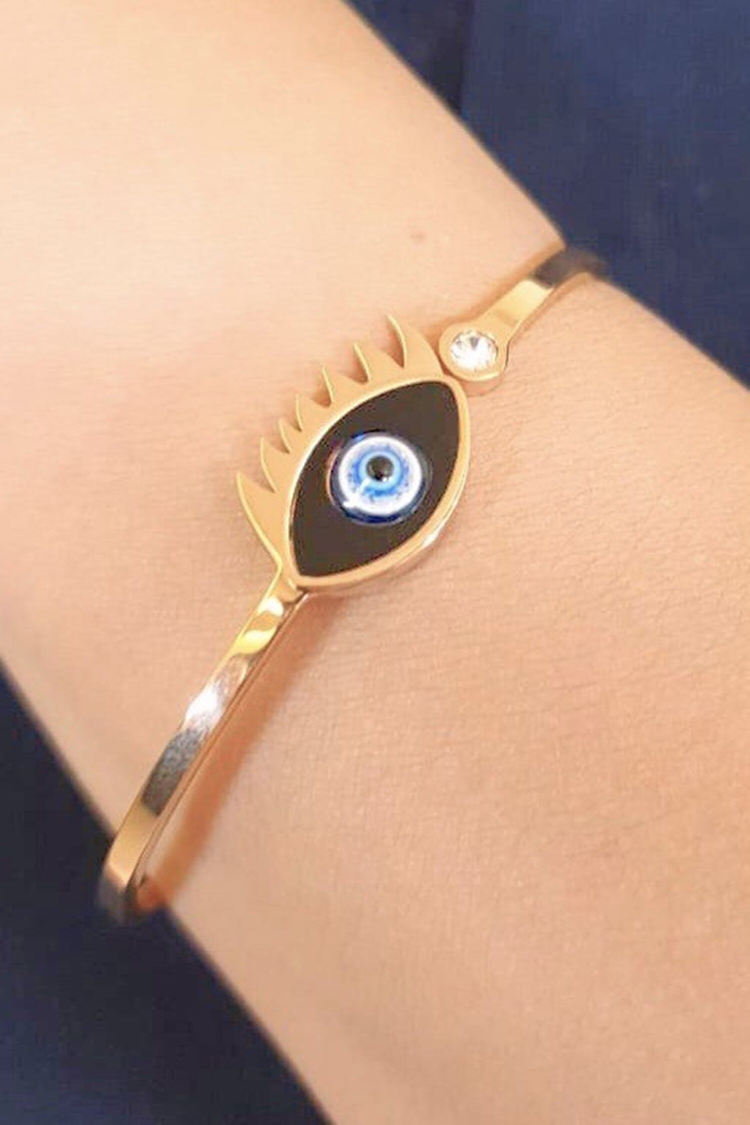 Buy Gold Plated Metal Evil Eye Bangle by Minaki Online at Aza Fashions.
