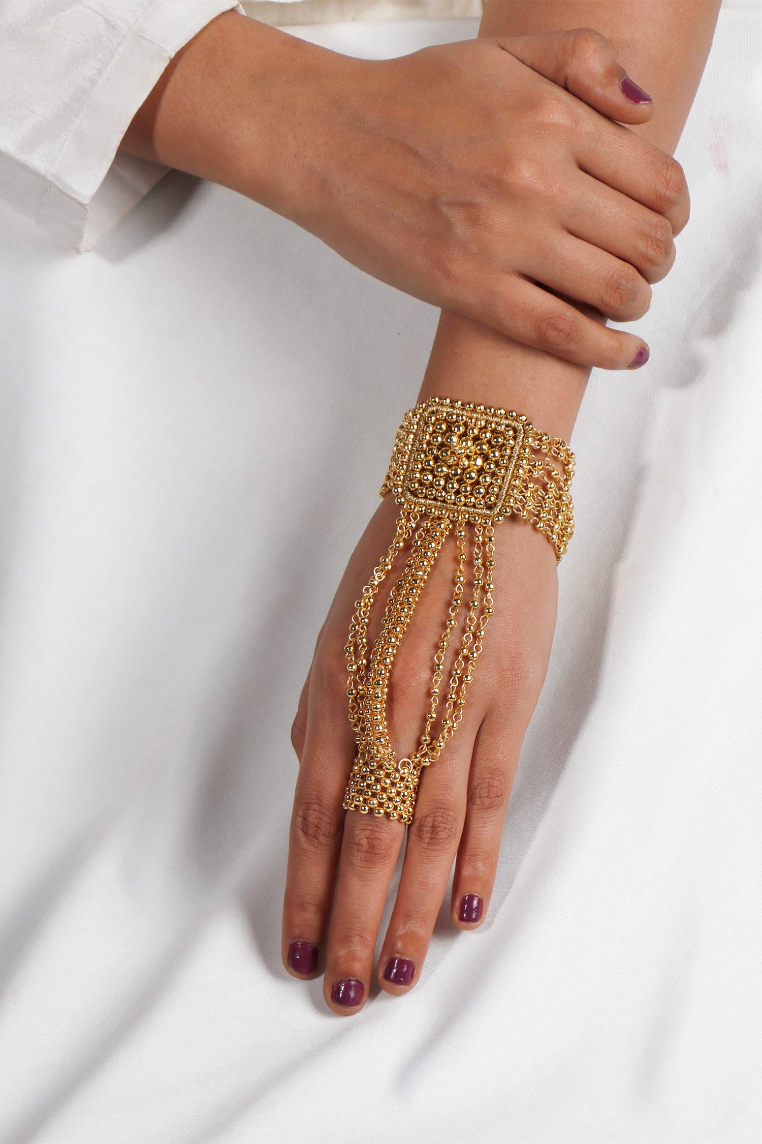 Buy Gold Plated Bead Alani Pearl Embellished Hathphool by Vaidaan Online at Aza Fashions.