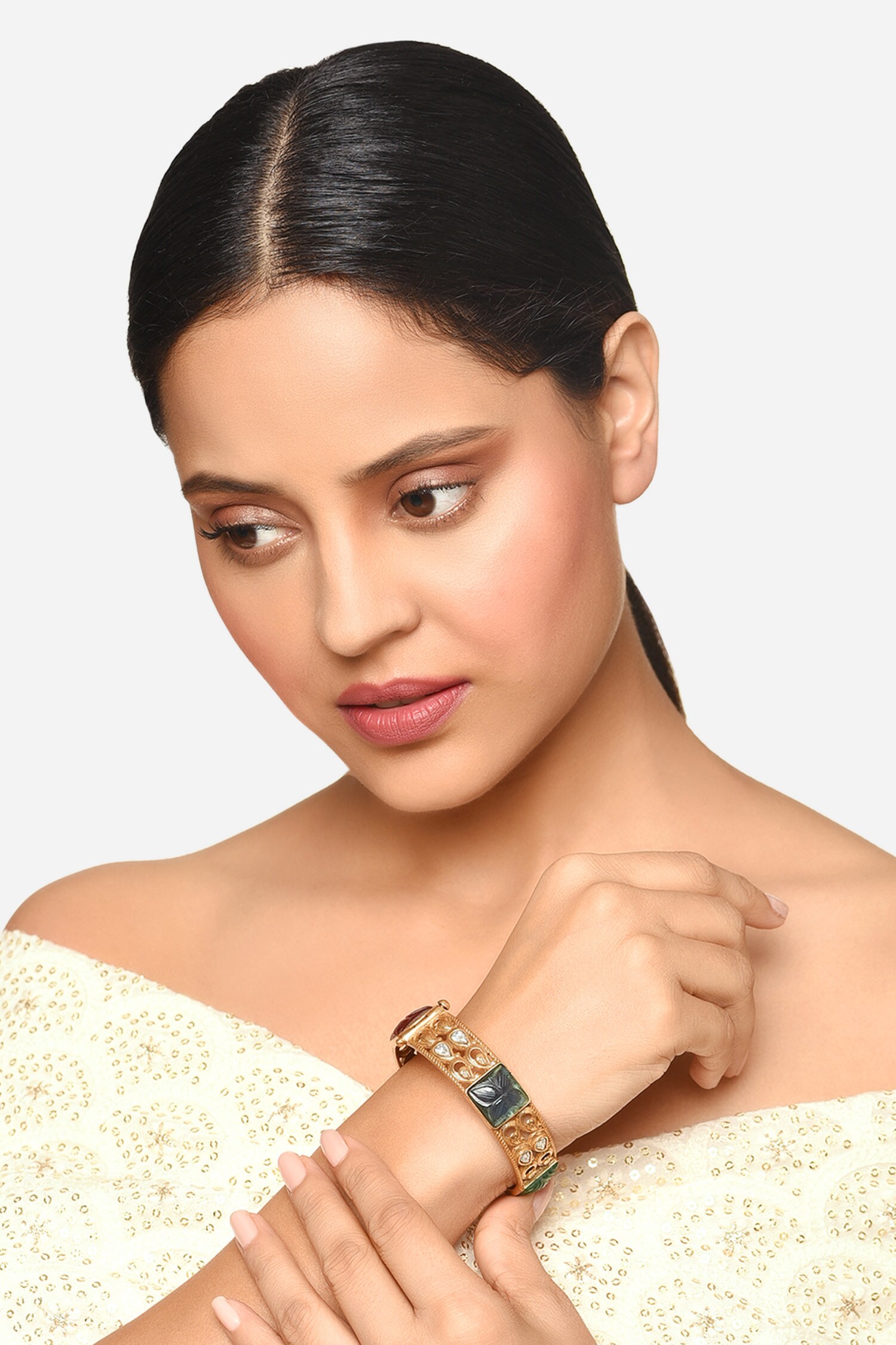 Buy Gold Plated Cutwork Paisley Bangle by Raga Baubles Online at Aza Fashions.