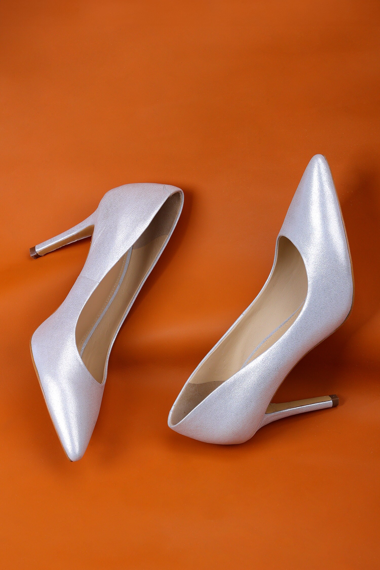Buy Silver Plain Coral Metallic Pumps by OROH Online at Aza Fashions.