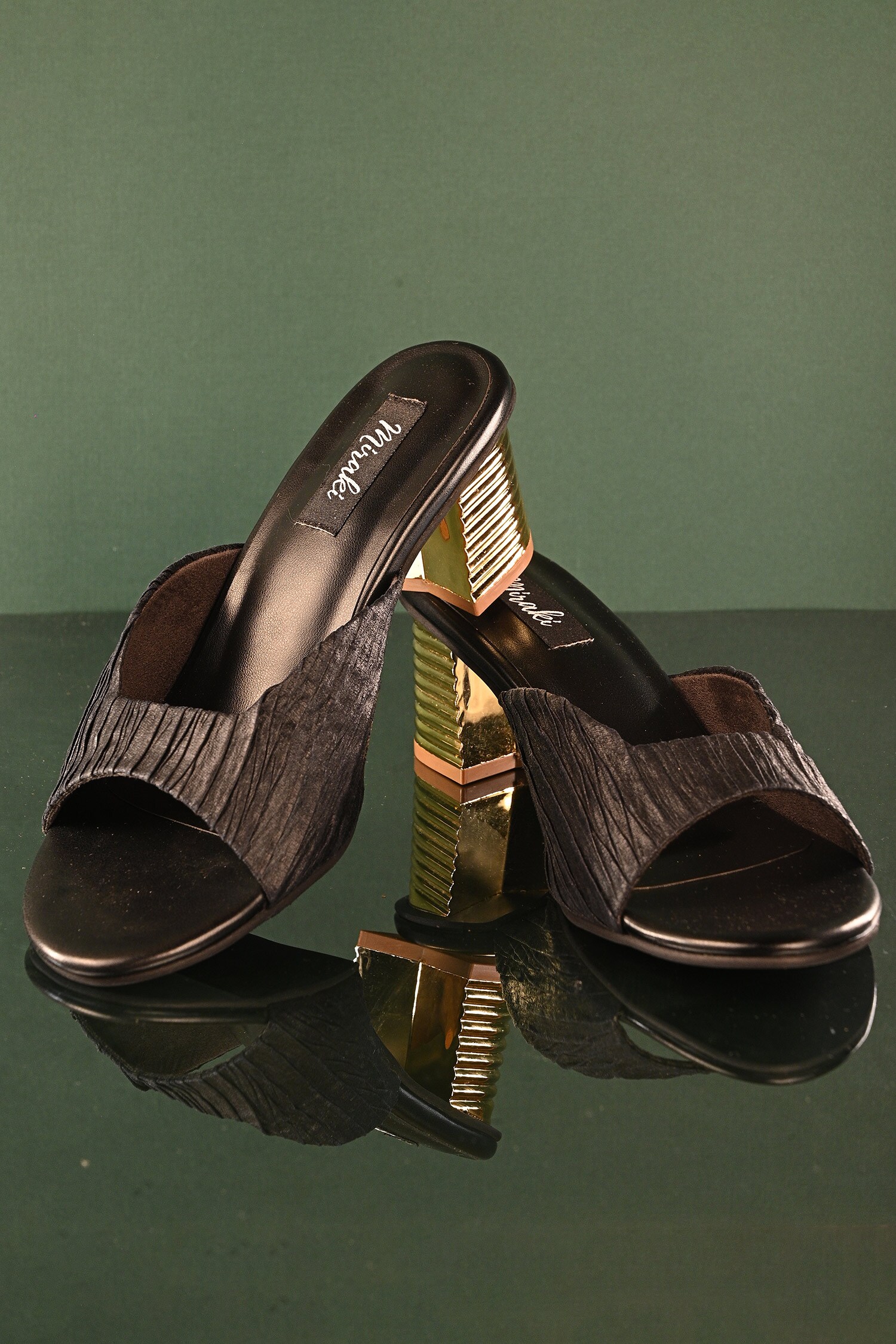 Buy Black Textured Strap Flare Heels by Miraki Online at Aza Fashions.