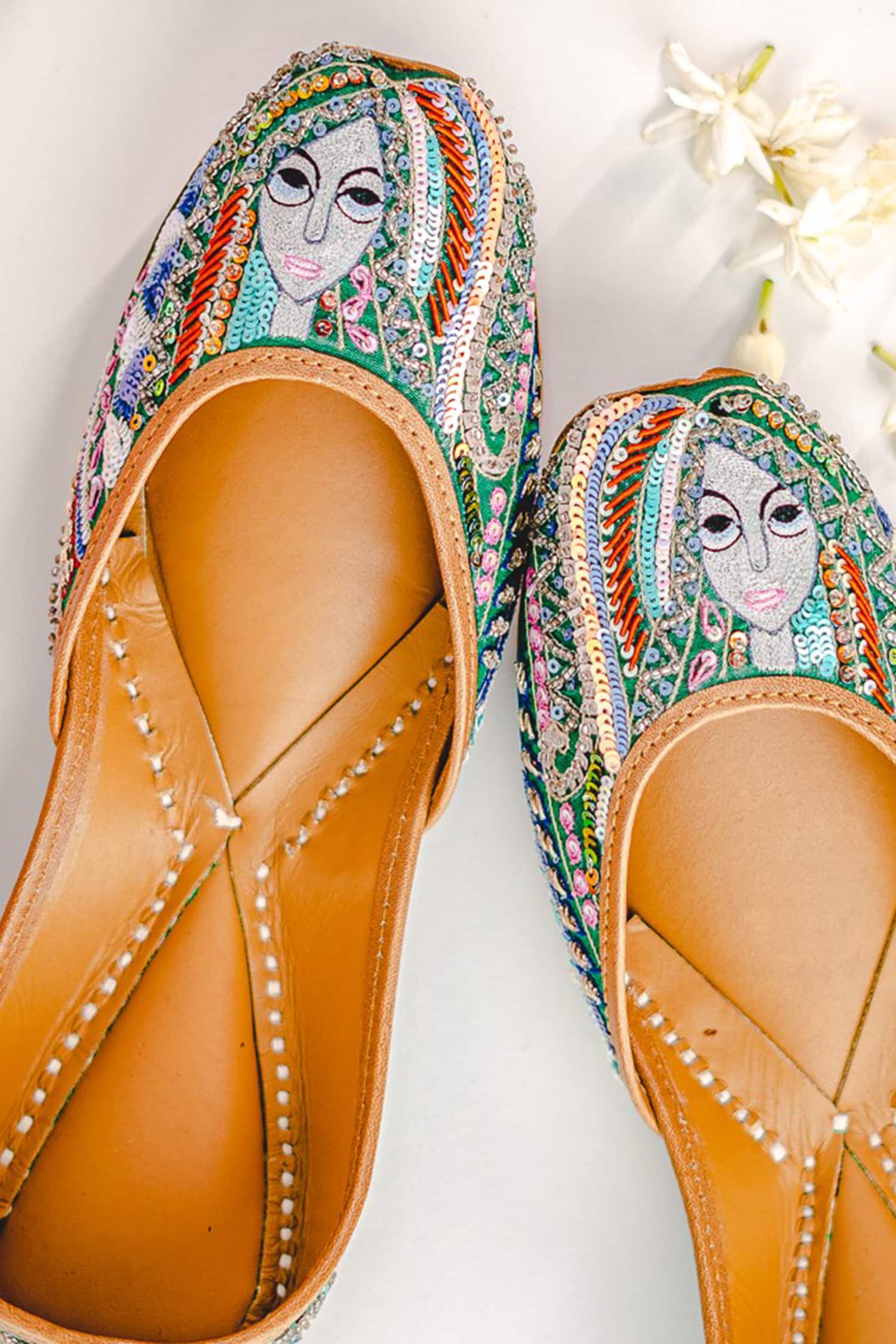 Buy NR BY NIDHI RATHI Green Fabric Thread And Sequin Embellished Juttis ...