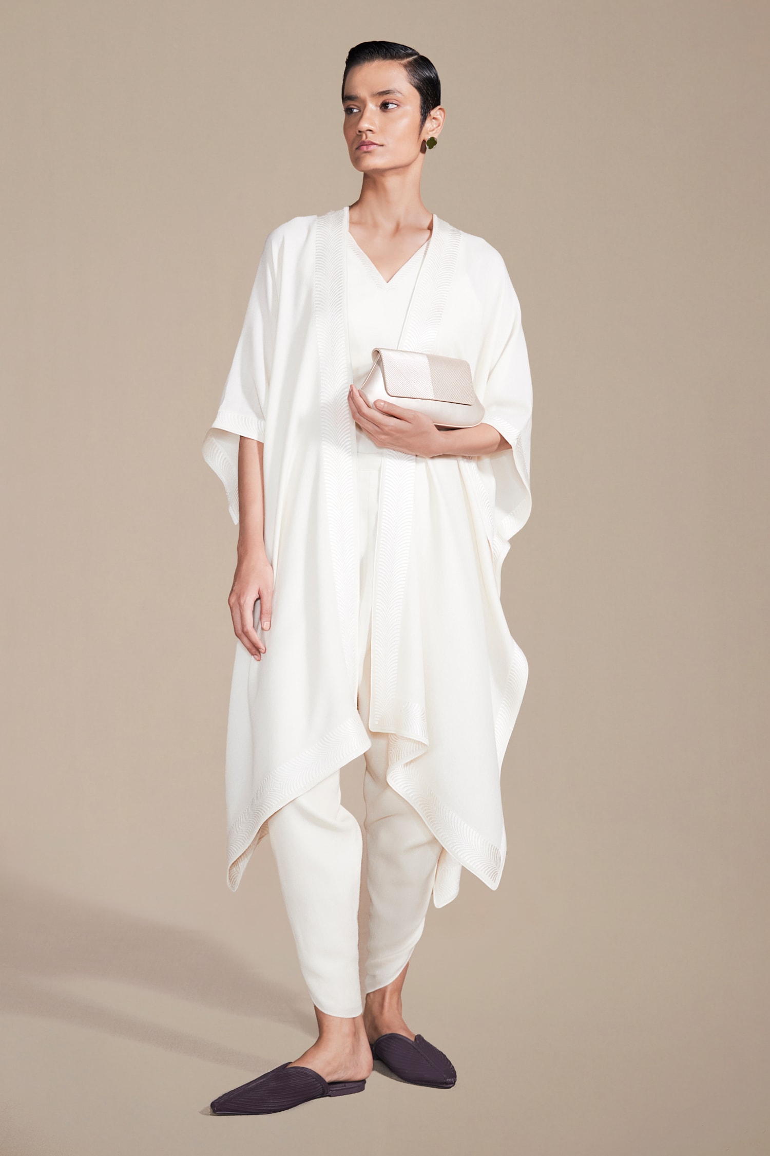 Buy Off White Abstract Azra Pattern Clutch by AMPM Online at Aza Fashions.