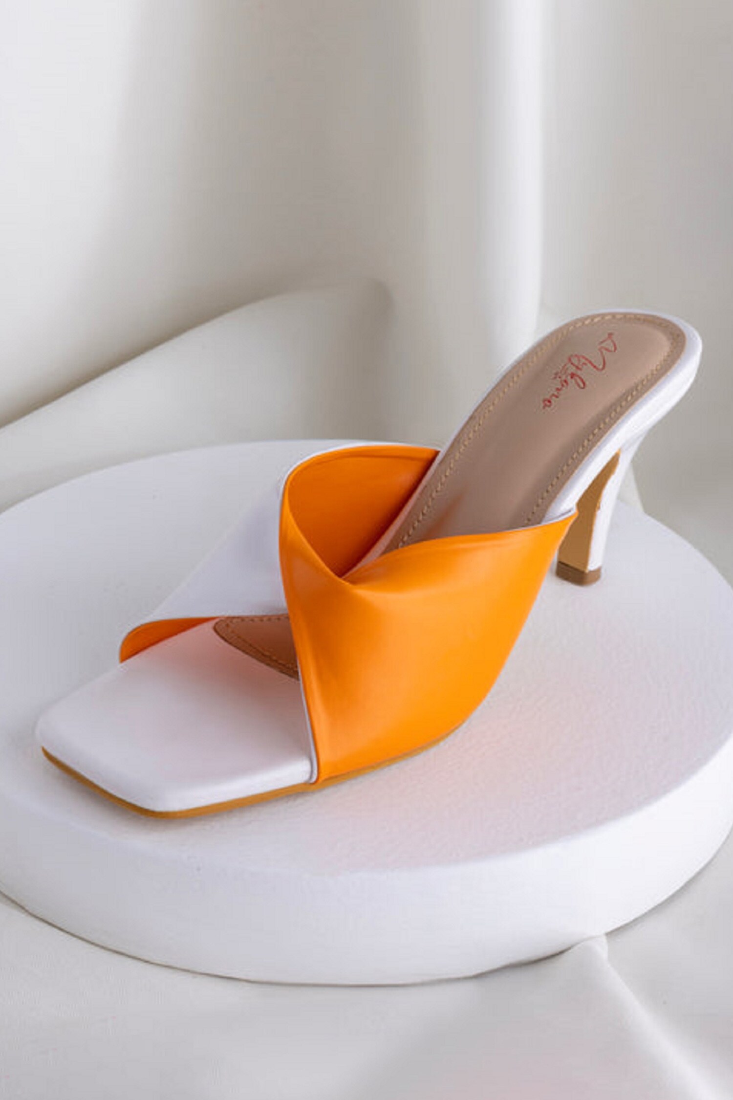 Buy Orange Camille Twisted Spool Heels by MYKONO Online at Aza Fashions.