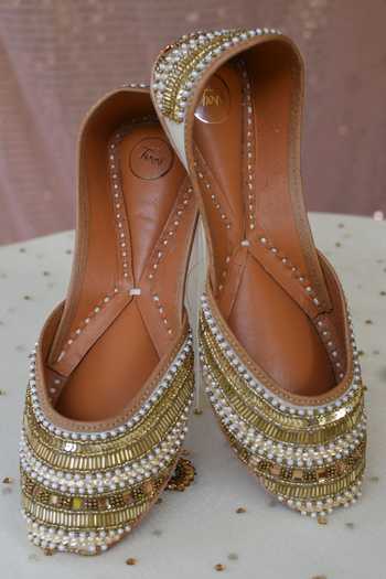 Buy Gold Nalki Helix Moti Embroidered Juttis by Moy Online at Aza Fashions.