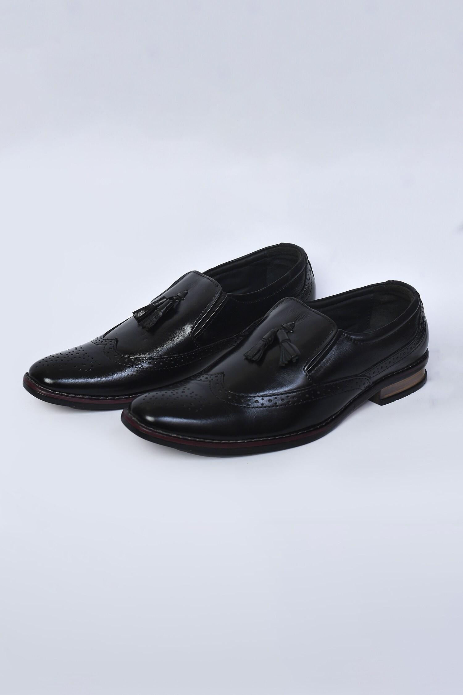 Buy Black Leather Slip On Brogue Shoes For Men by Arihant Rai Sinha ...