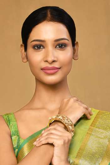 Buy Gold Plated Pearl Elephant Carved Bangle by Anjali Jain Online at ...
