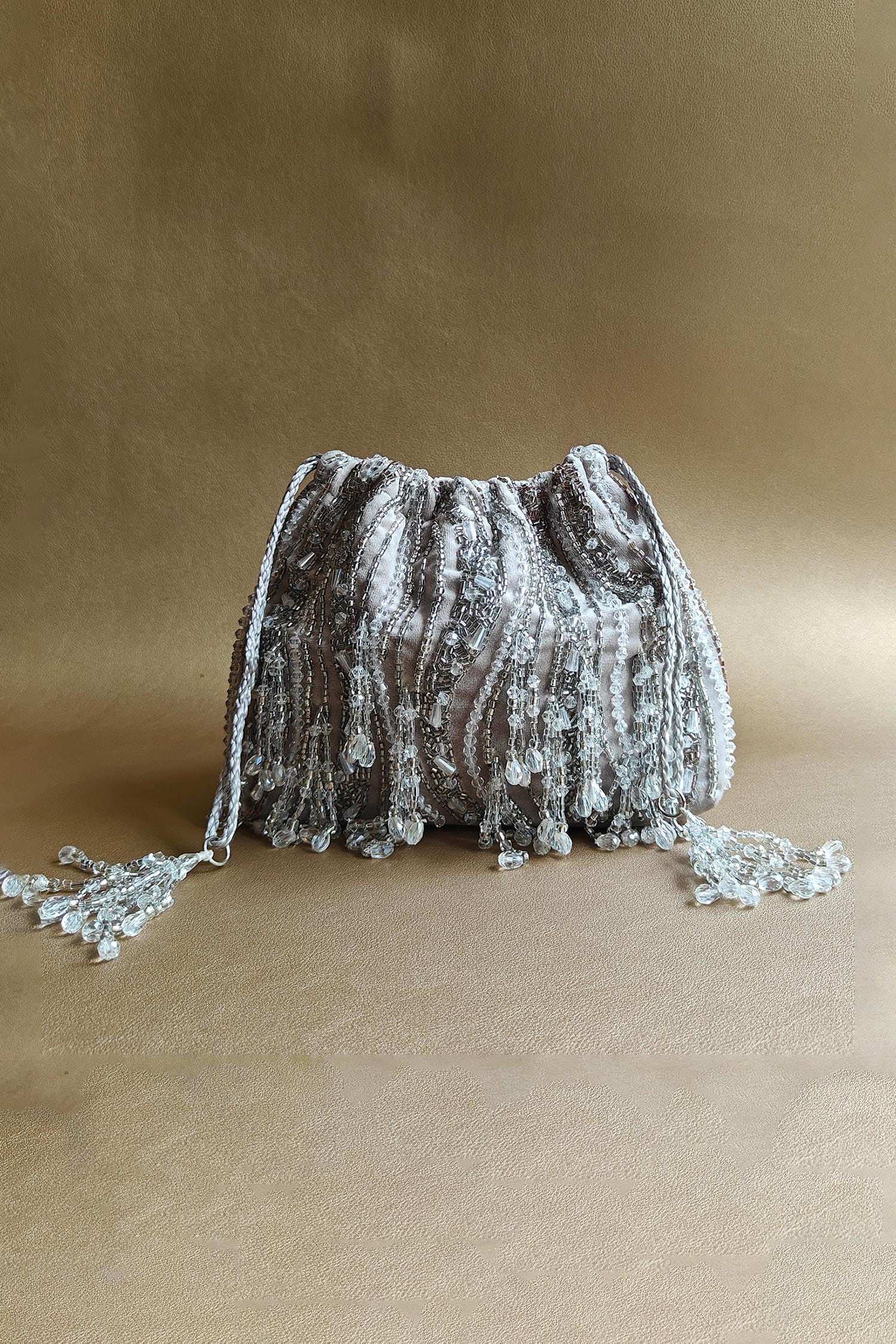 Buy Grey Embellished Crystal Bead Potli by Plode Online at Aza Fashions.