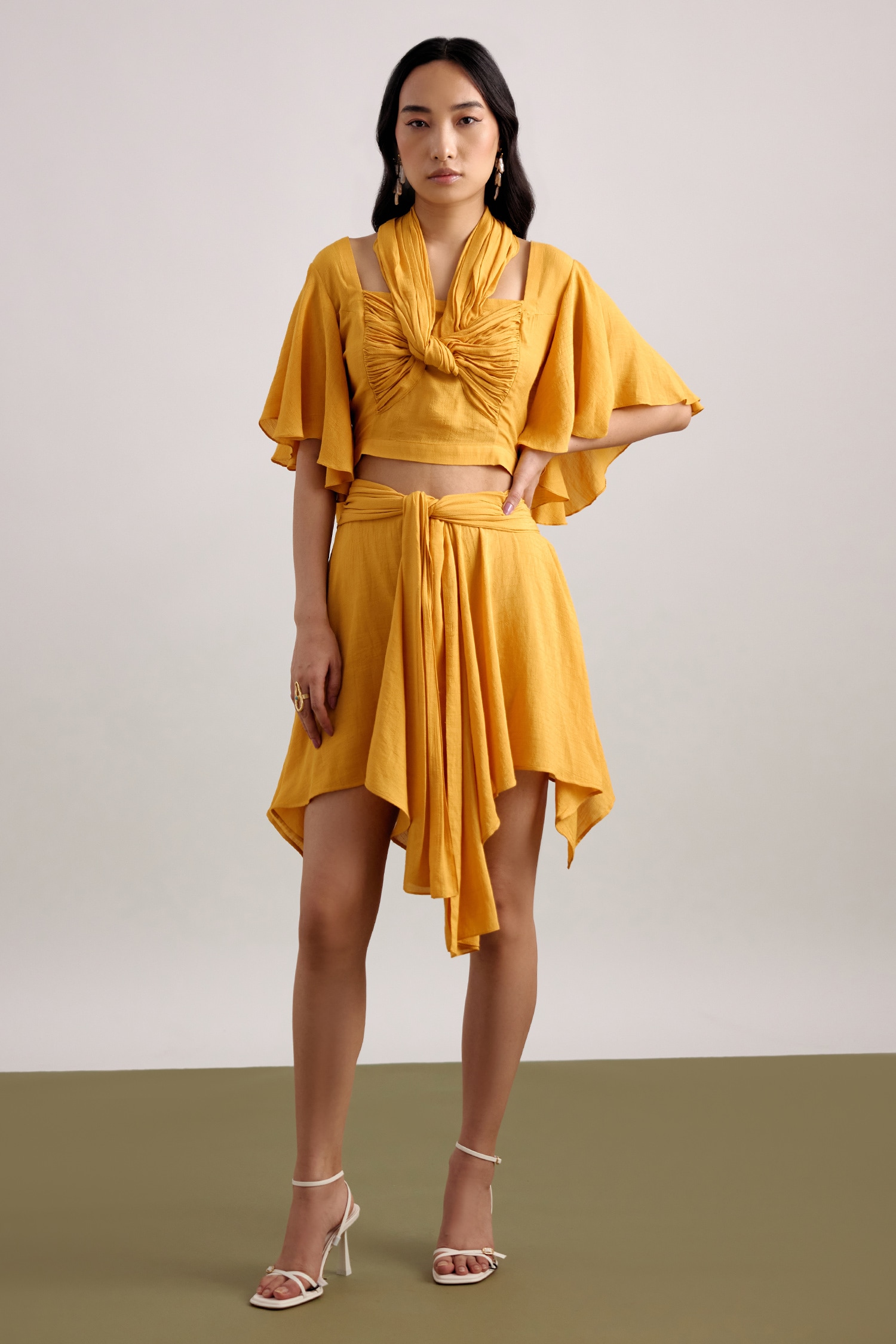 Buy Yellow Linen Crepe Plain Halter Knotted Draped Crop Top And Skirt ...