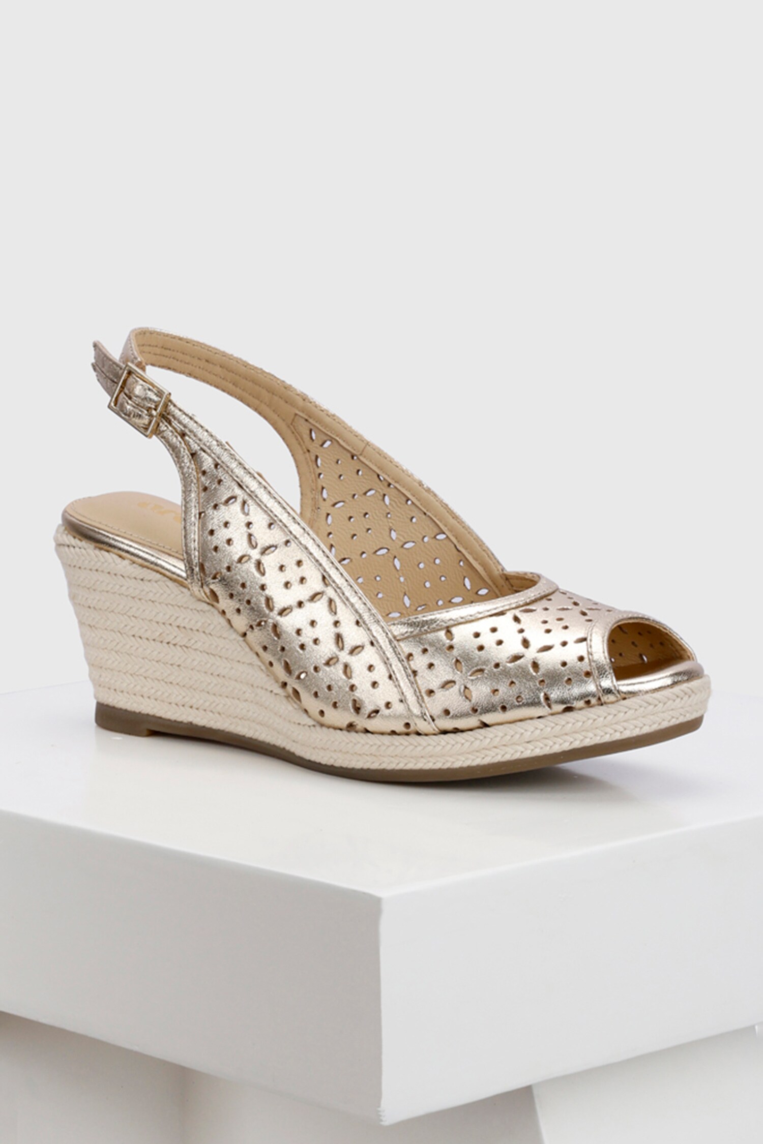 Buy Gold Textured Savannah Cut-out Wedges by OROH Online at Aza Fashions.
