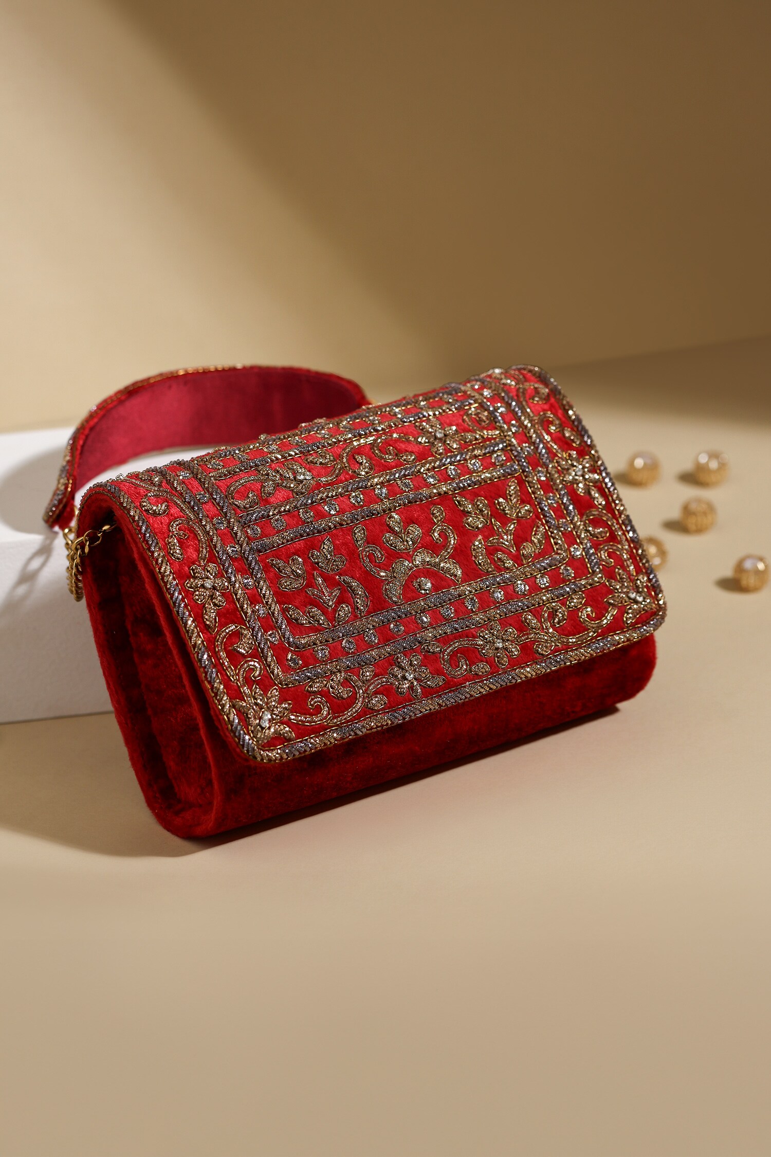 Buy Maroon Stones Gul Embellished Clutch by Be Chic Online at Aza Fashions.