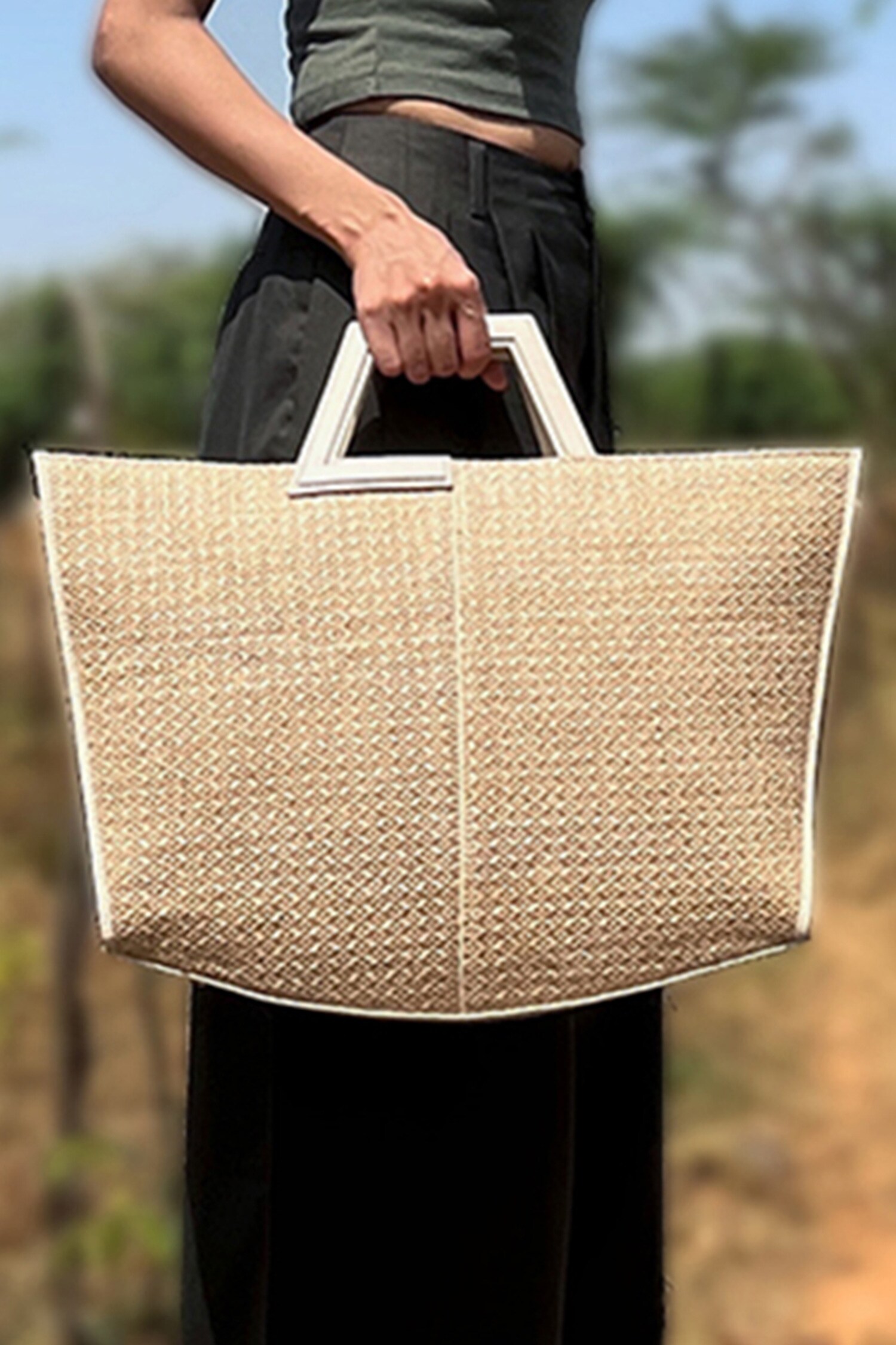 Buy Ivory Sol Textured Tote Bag by ADISEE Online at Aza Fashions.