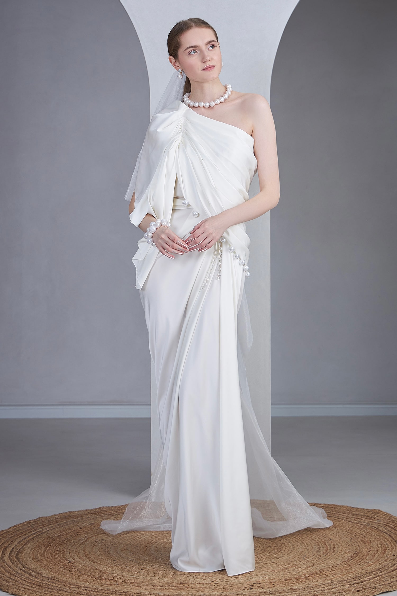Buy White Satin Silk Embellished Pearl One Shoulder Pleated Draped Gown For Women by NAINA SETH ...
