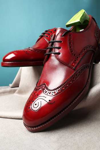 Buy Red Textured Leather Perforated Brogue Shoes For Men by FELLMONGER ...
