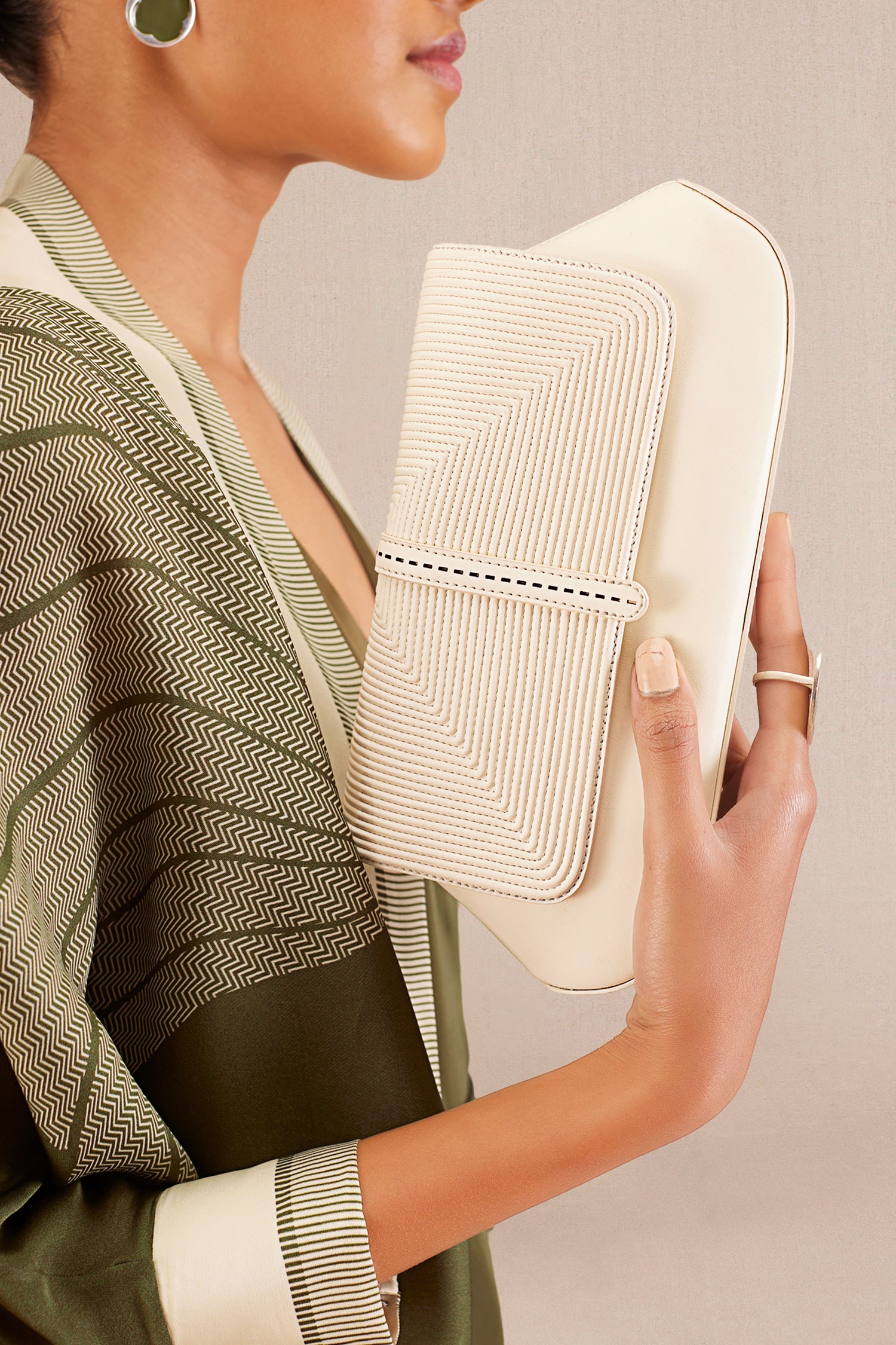Buy Ivory Izrah Envelope Textured Clutch by AMPM Online at Aza Fashions.