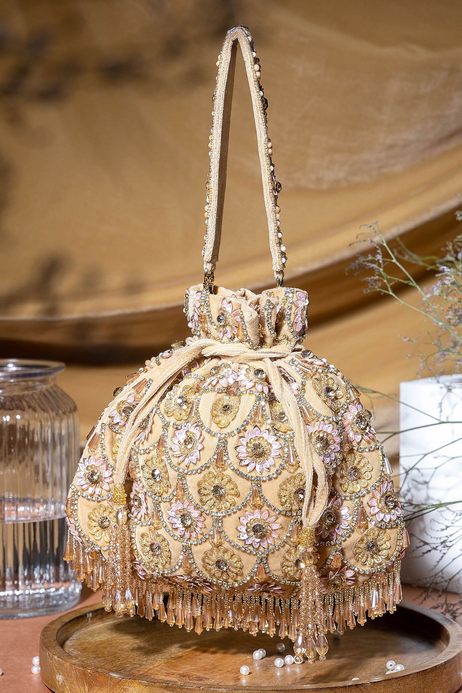 Buy Gold Tassels Oishi Velvet Floral Motif Work Potli Bag by EENA ...