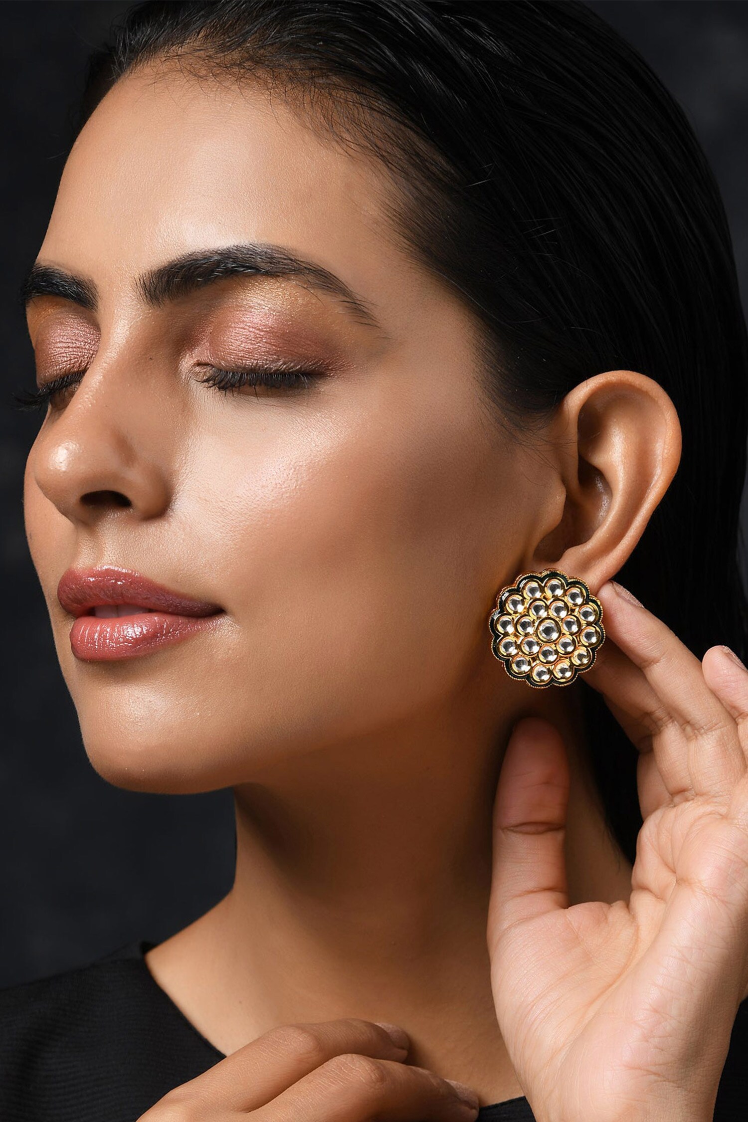 Buy Gold Plated Kundan Floret Carved Studs by Paisley Pop Online at Aza Fashions.