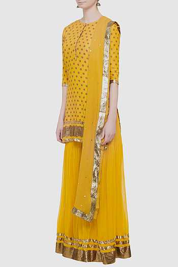 Buy Yellow brocade kurta set by Heli Shah at Aza Fashions