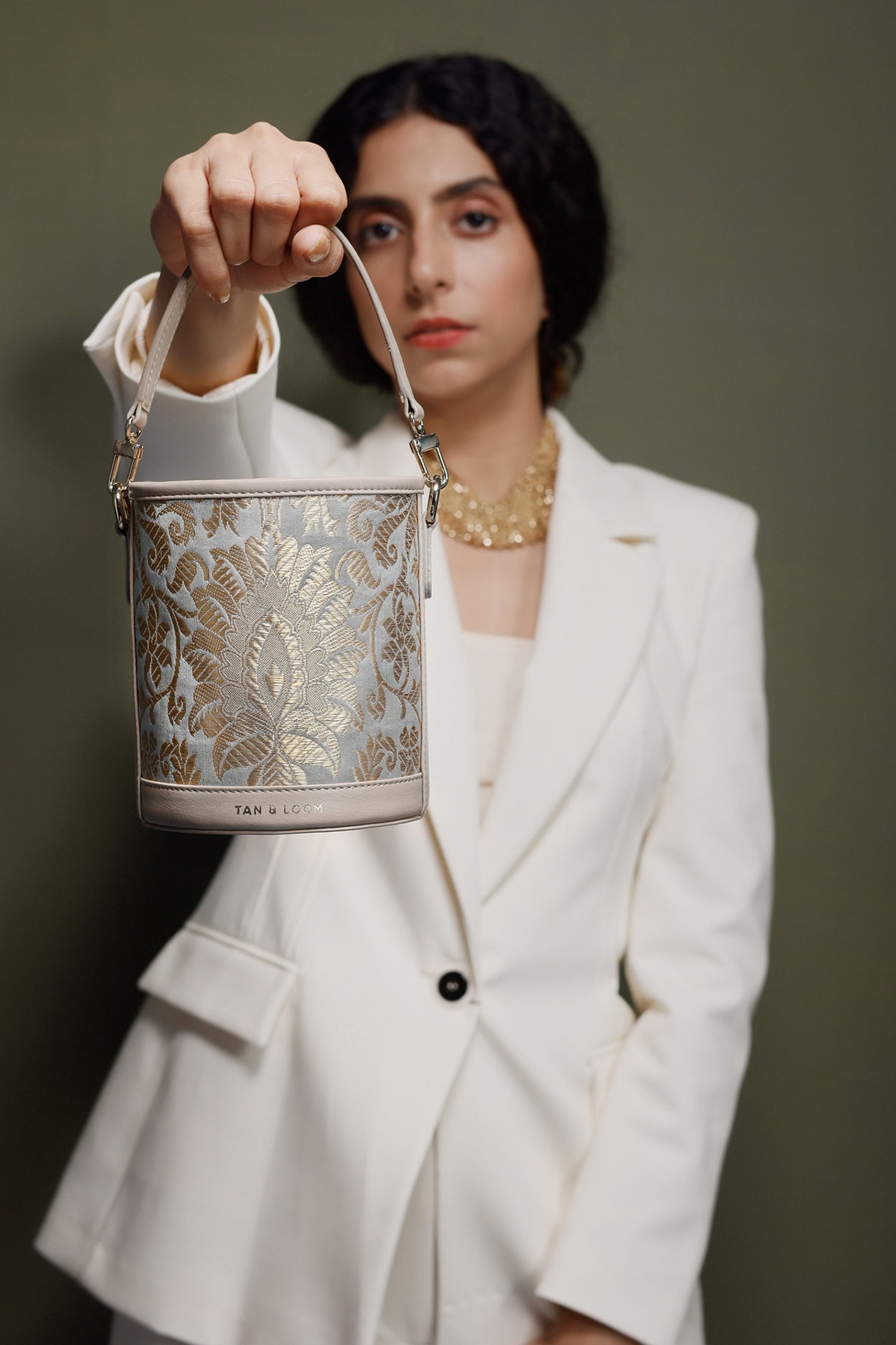 Buy Green Woven Banarasi Floral Potli by Tan & Loom Online at Aza Fashions.