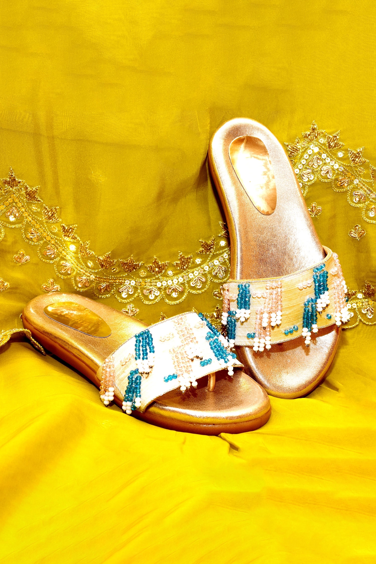 Buy Gold Embellished Tassel Flats by Foot Fuel Online at Aza Fashions.
